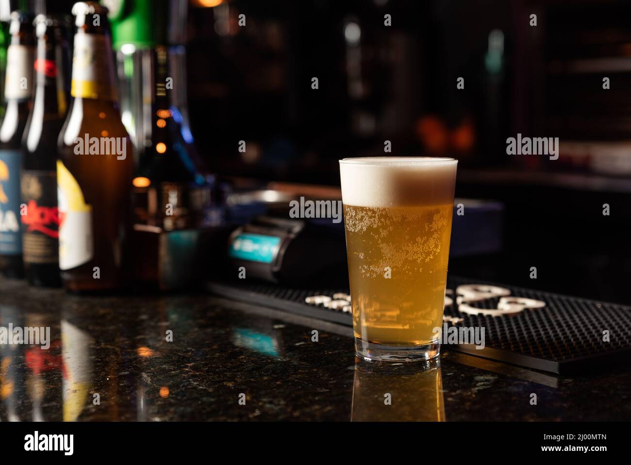 glass of beer on the bar counter Stock Photo - Alamy