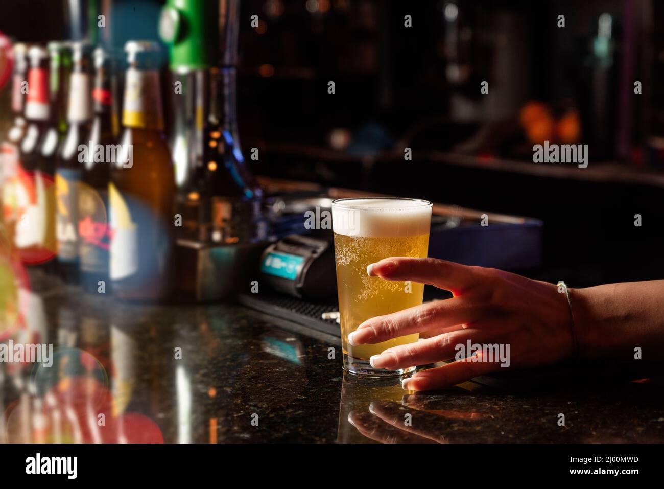 glass of beer on the bar counter Stock Photo - Alamy