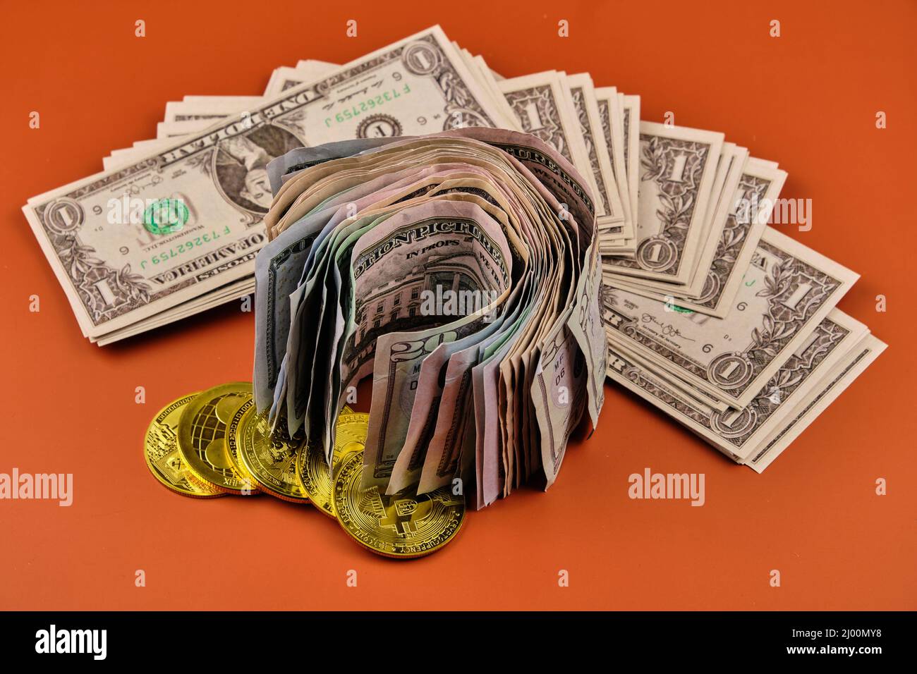 Bitcoin coins with a lot of US Dollars in a orange background Stock ...