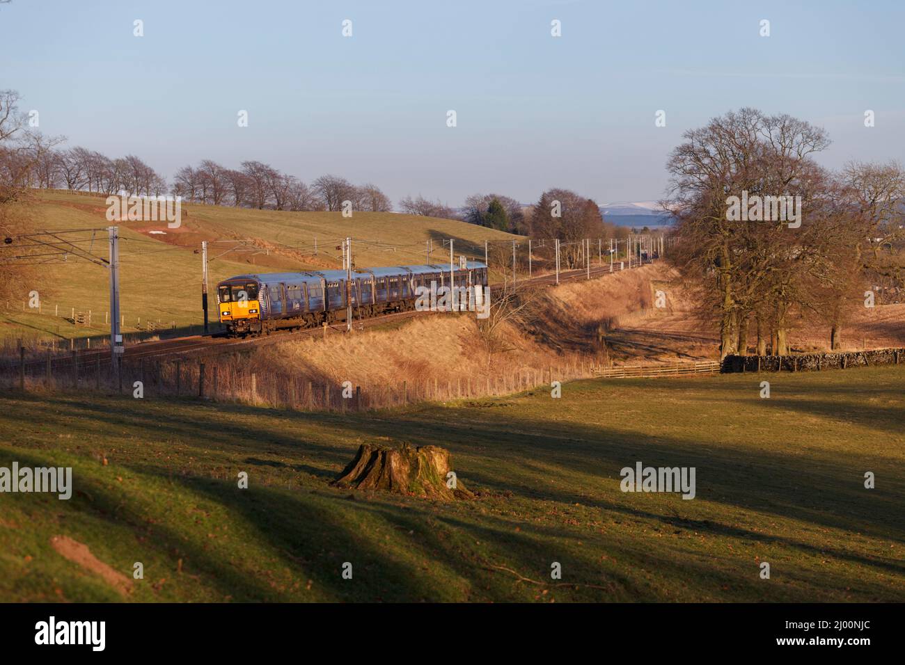 2 Scotrail class 318 electric trains pass Cleghorn (north of Carstairs ...