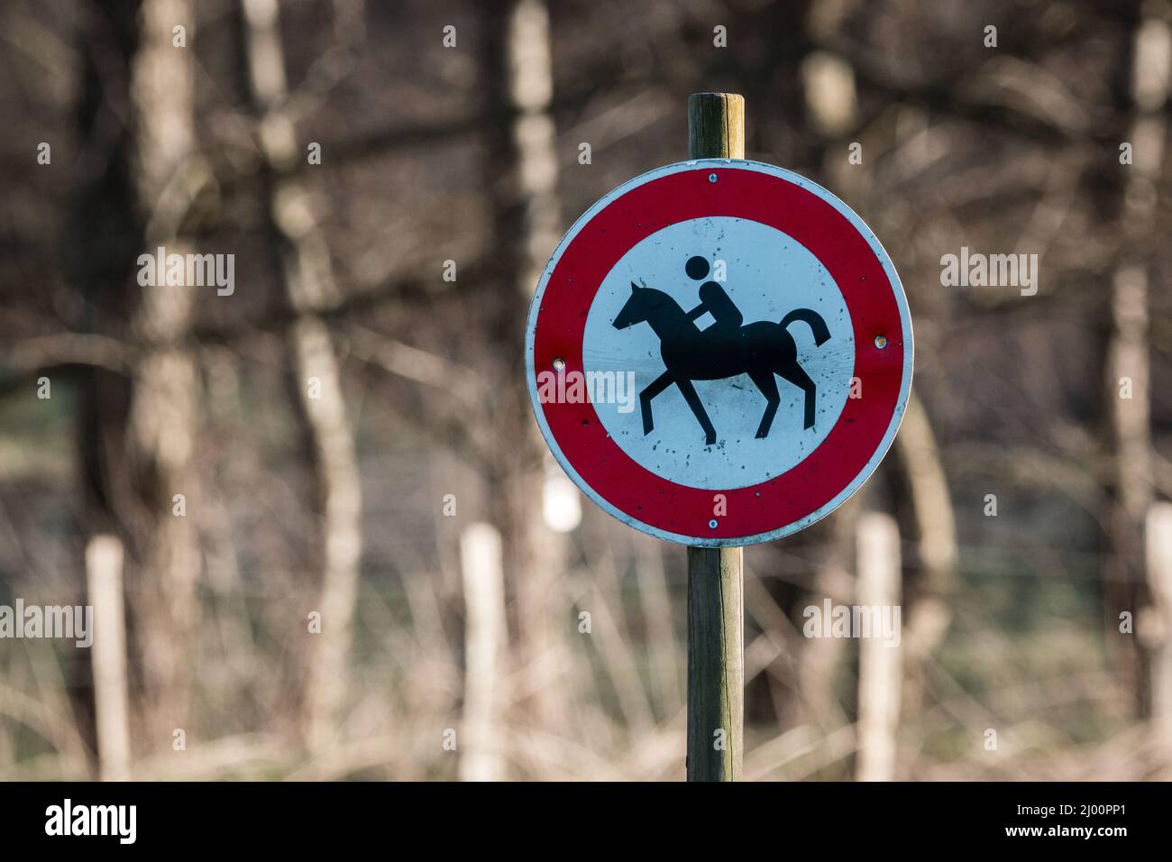 A metal sign indicating that riding is prohibited Stock Photo - Alamy