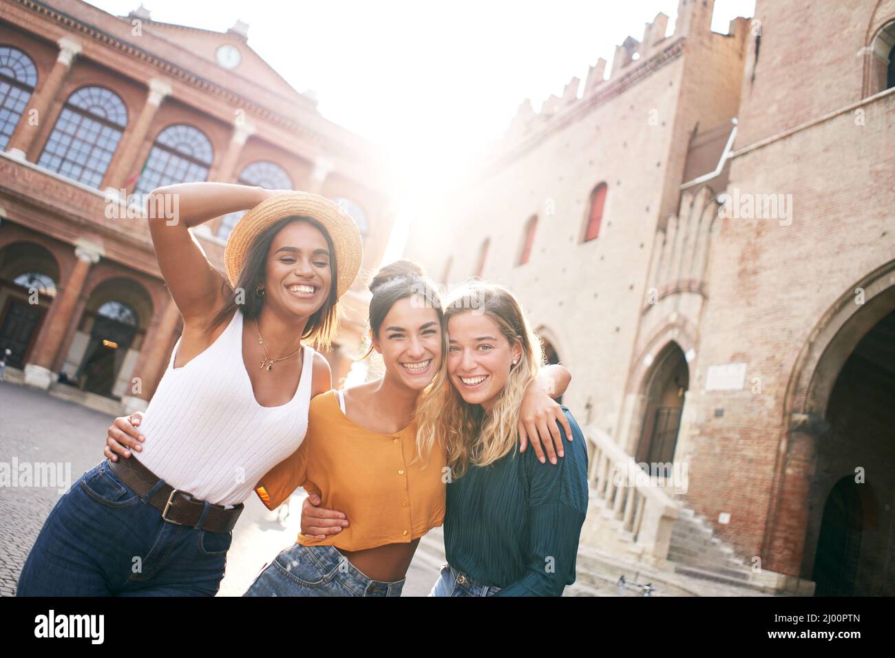 Three happy female friends having fun outdoors in summer vacations at ...