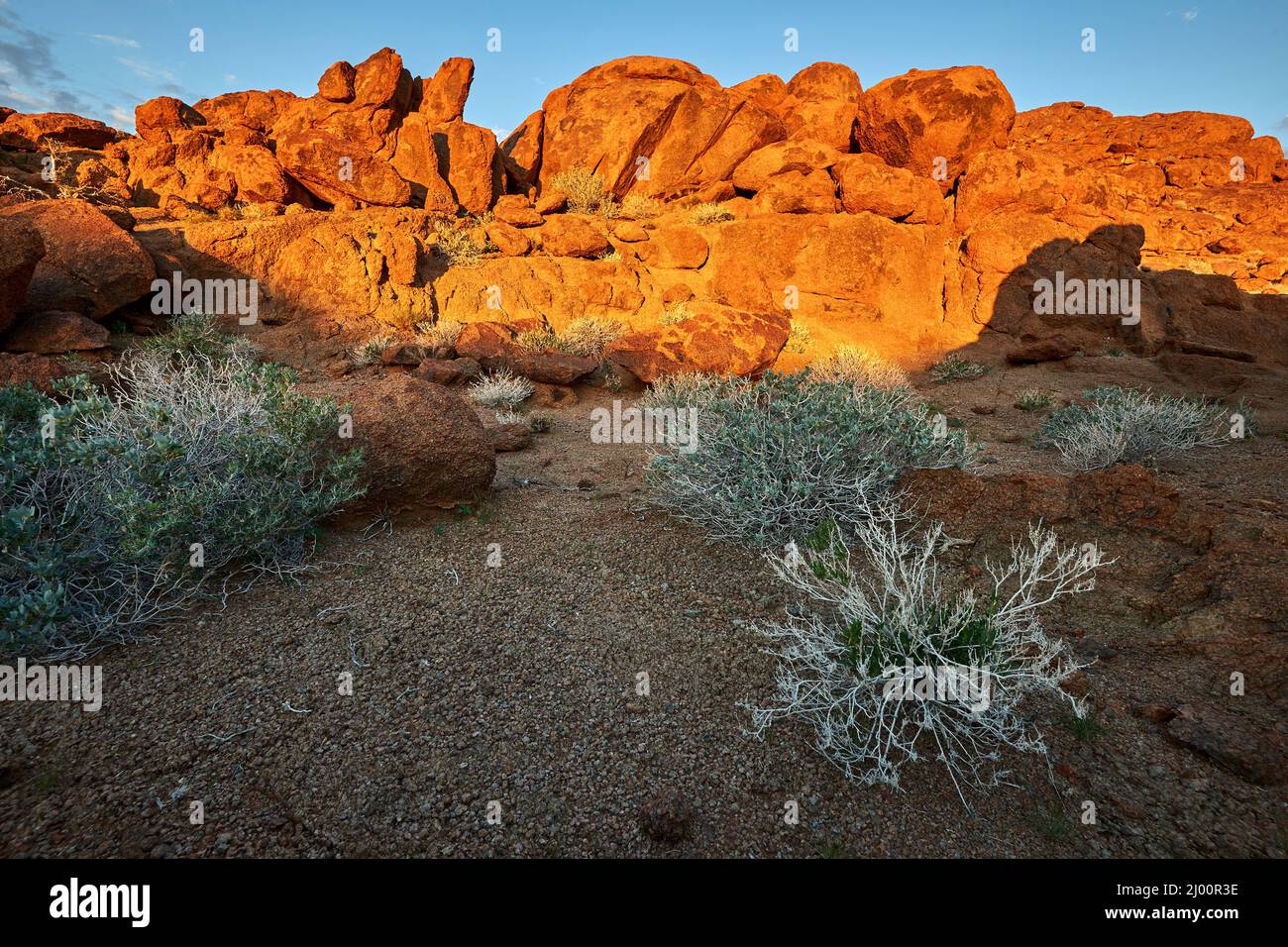 Namibian sunset landscape with big red rocks Stock Photo - Alamy