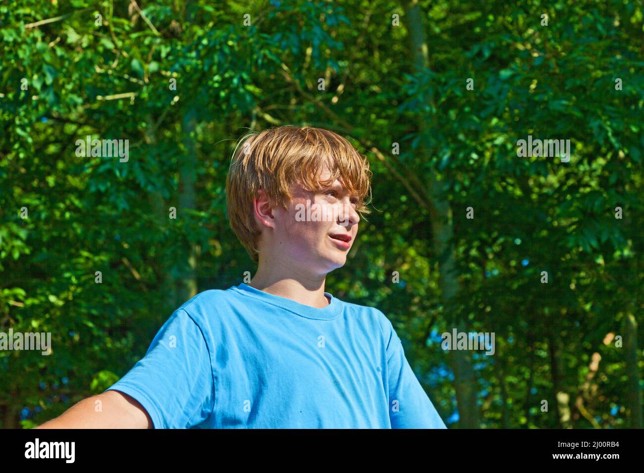 cute boy sweating after outdoor sports in nature Stock Photo - Alamy