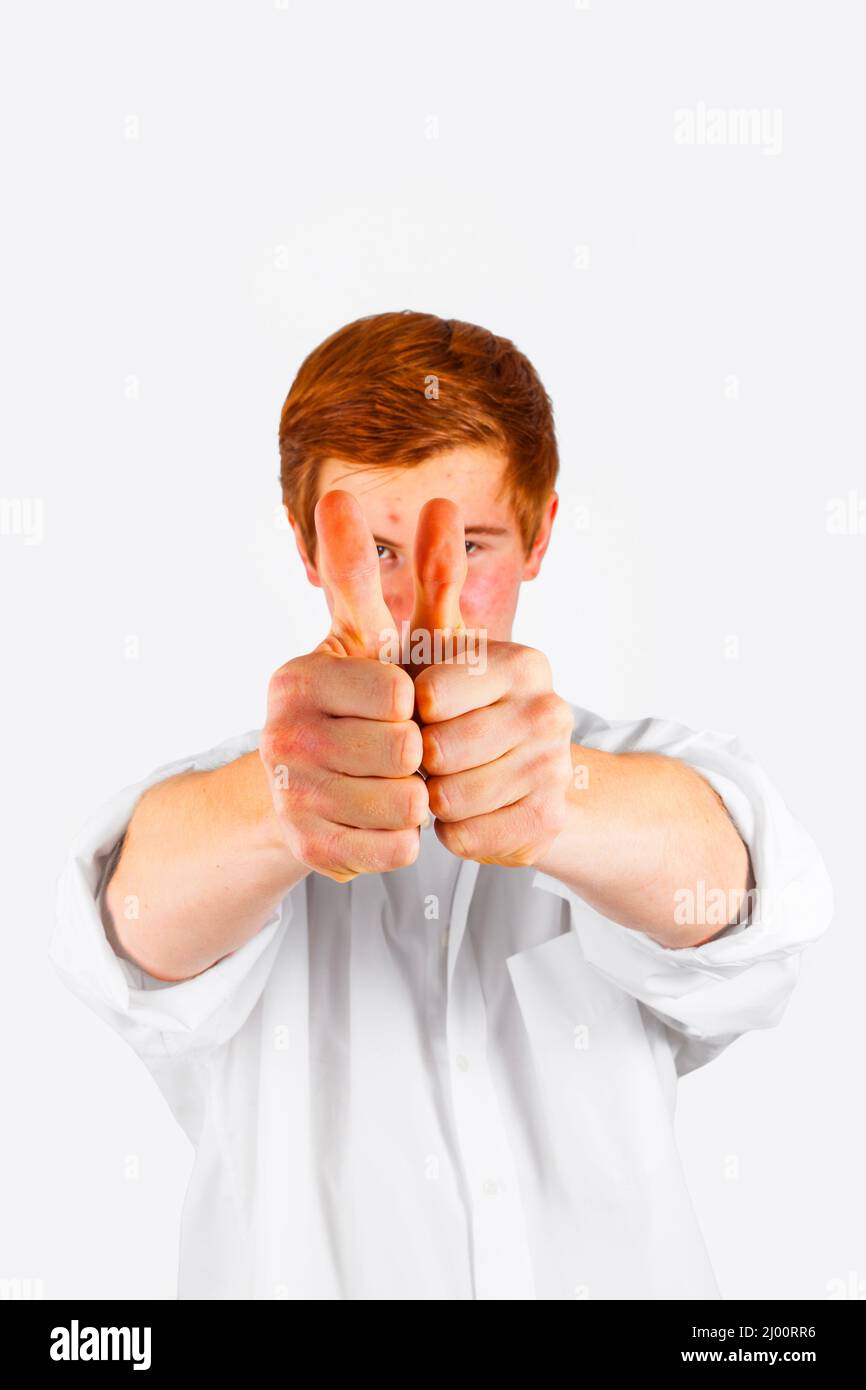 boy showing i like it sign with thumbs up Stock Photo - Alamy