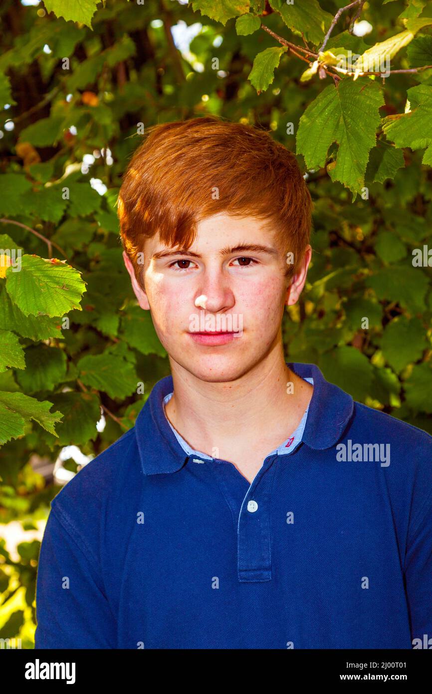 Boy under apple tree hi-res stock photography and images - Alamy