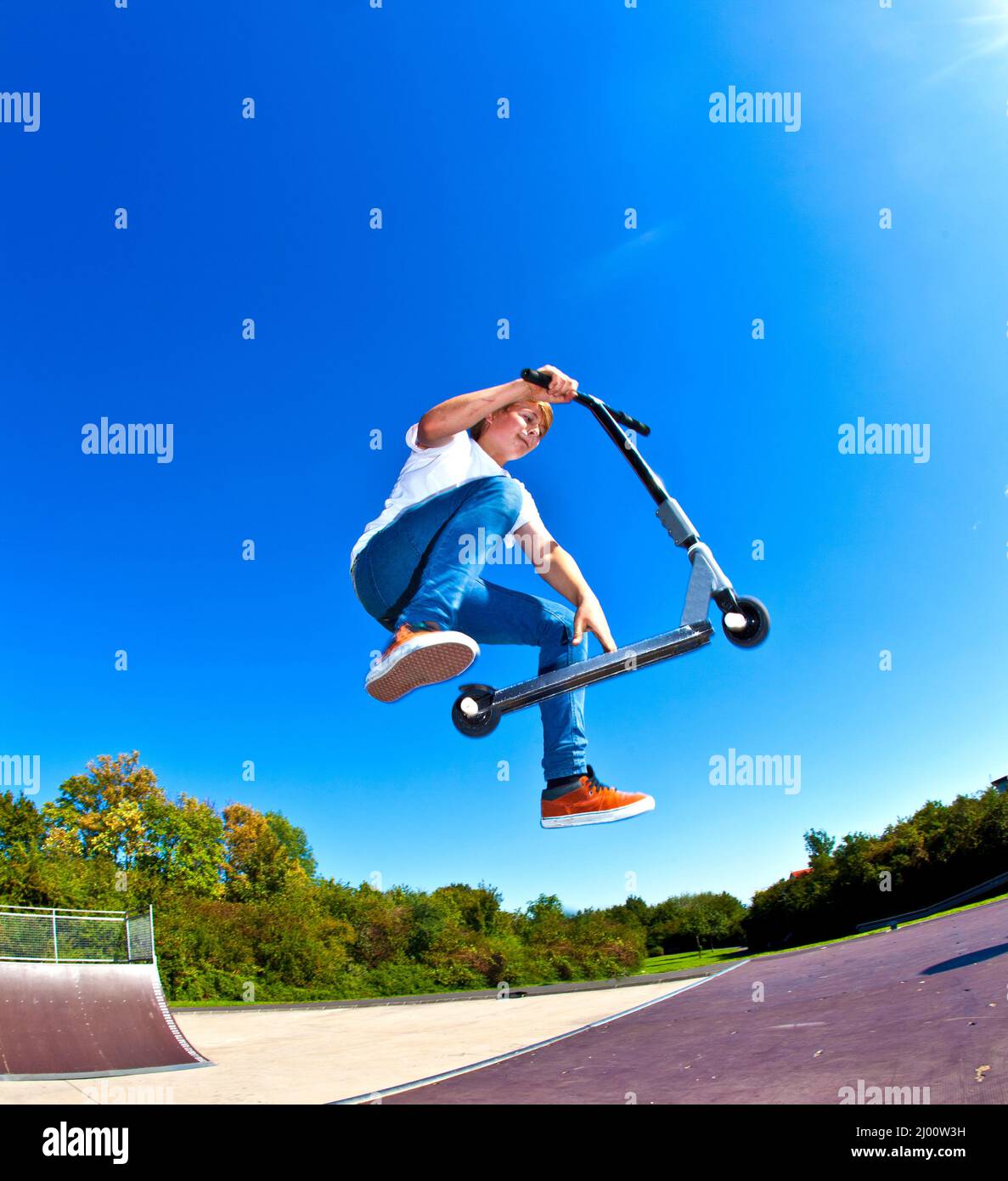boy jumping with his scooter Stock Photo - Alamy