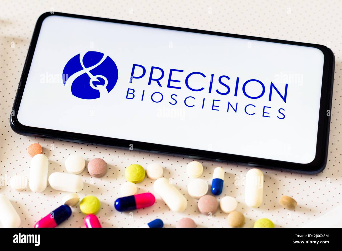 In this photo illustration the Precision BioSciences logo seen displayed on a smartphone next to ...