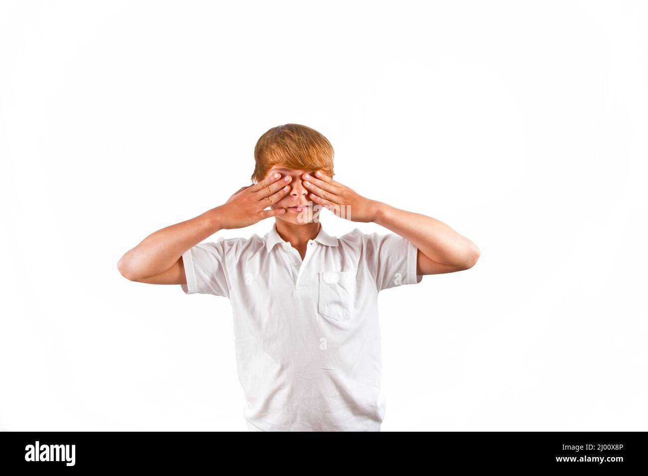 portrait of cute boy with closed eyes in studio Stock Photo - Alamy