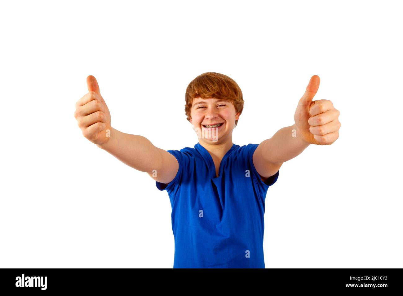A smiling boy is showing his thumb up; isolated on the white background ...