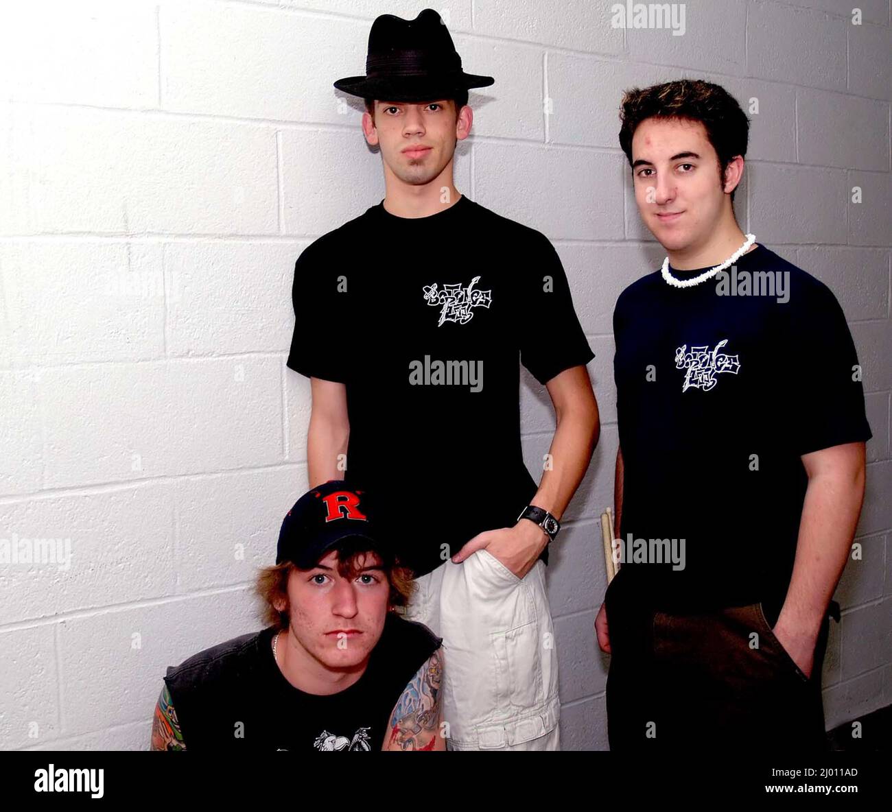 Teen rock band poses for an album cover Stock Photo - Alamy