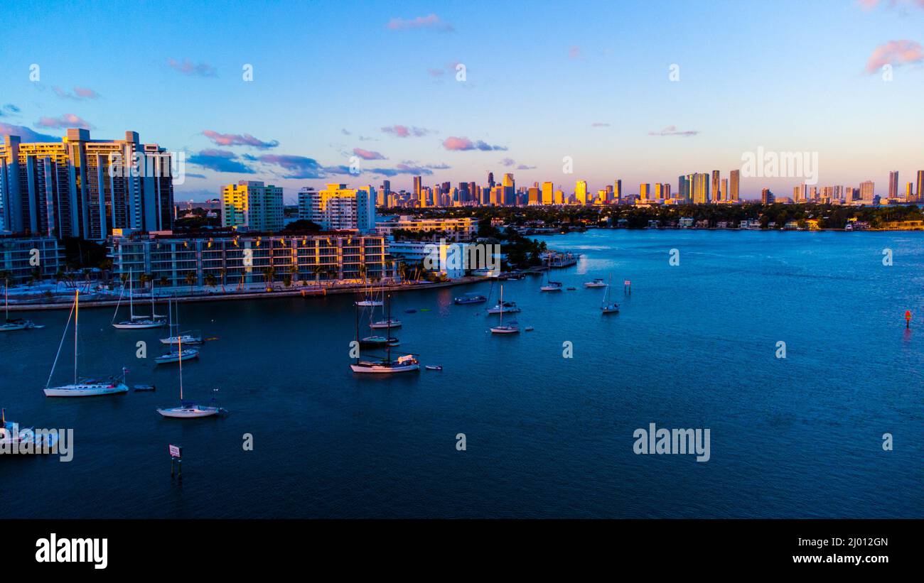 Scenic view over Miami skyline and waterway at golden hour in United ...