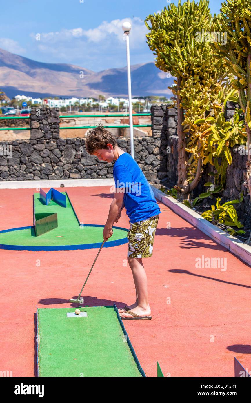 boy loves to play Mini-Golf Stock Photo - Alamy