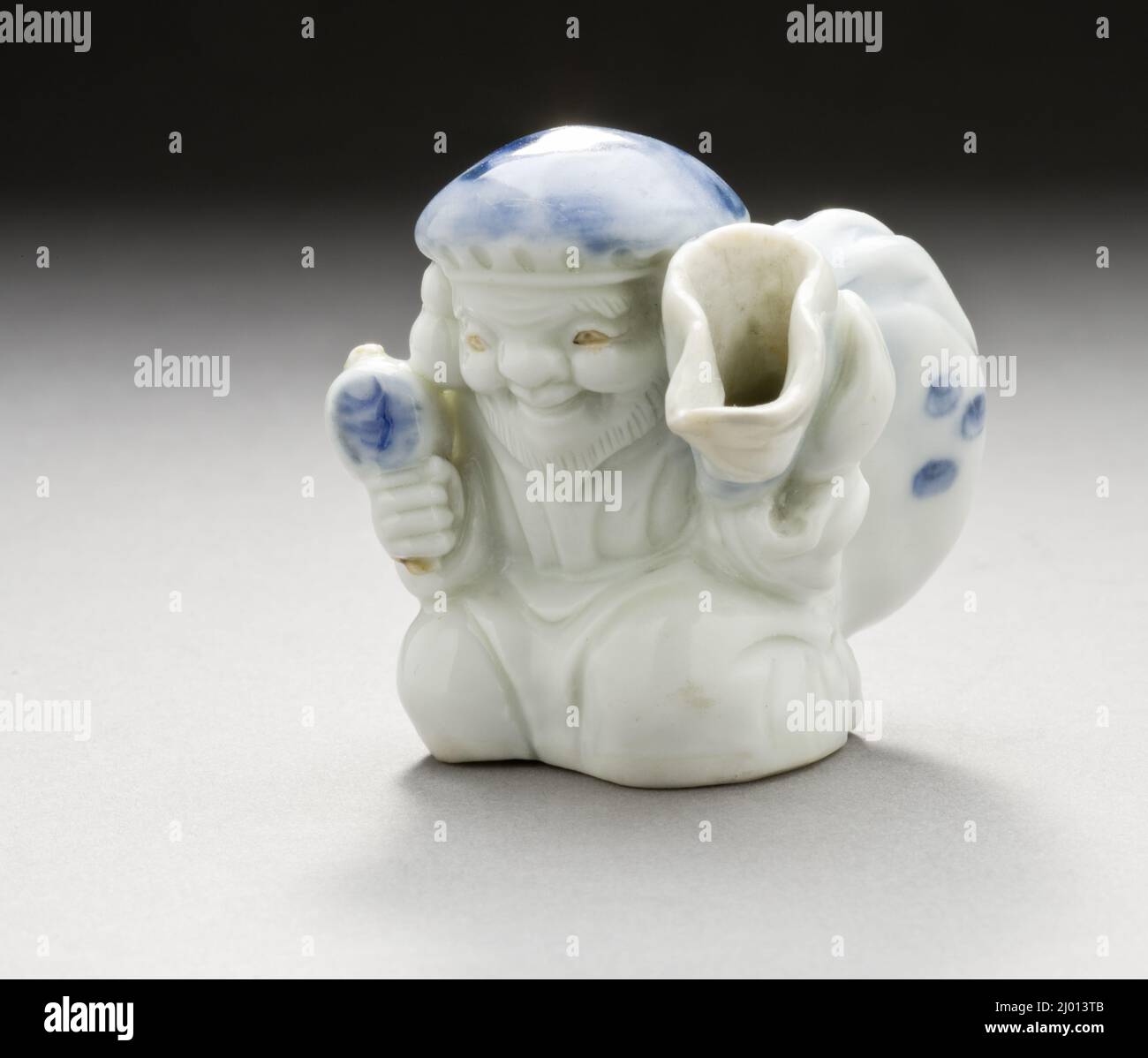 Water dropper in the form of daikoku hi-res stock photography and ...