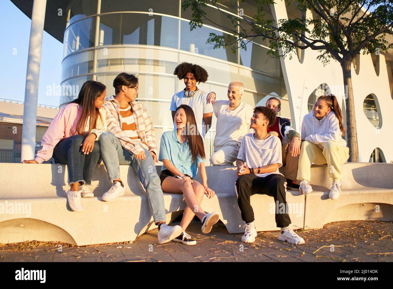 Happy group of students having fun together. Young people outdoors at ...