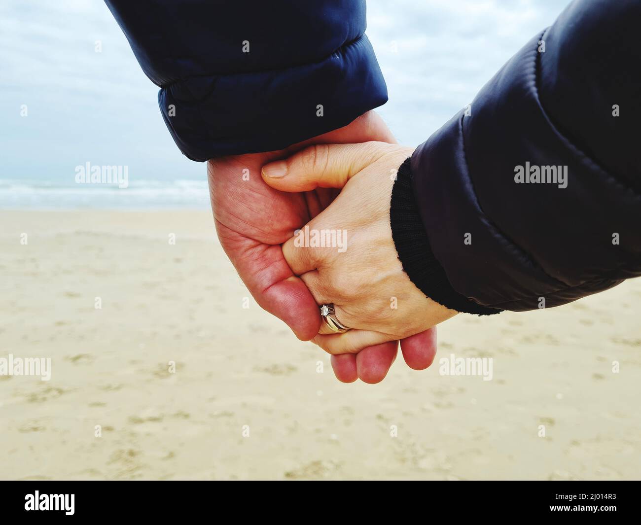 Two intertwined hands hi-res stock photography and images - Alamy