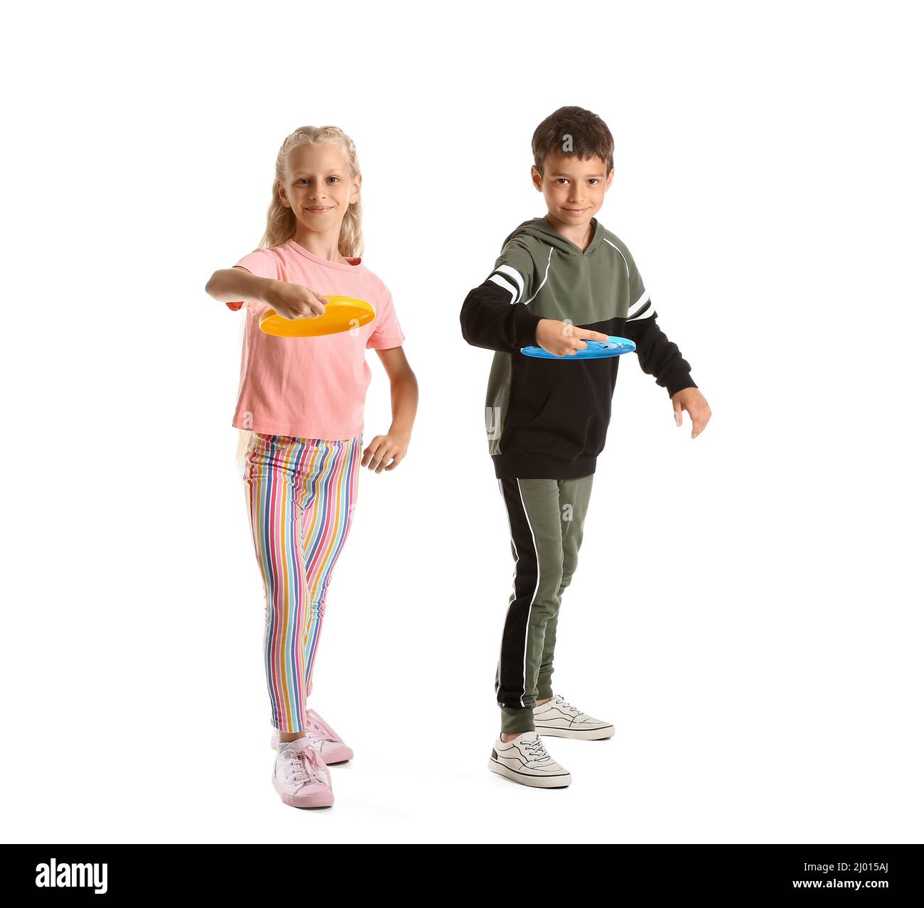 Funny children playing frisbee on white background Stock Photo - Alamy
