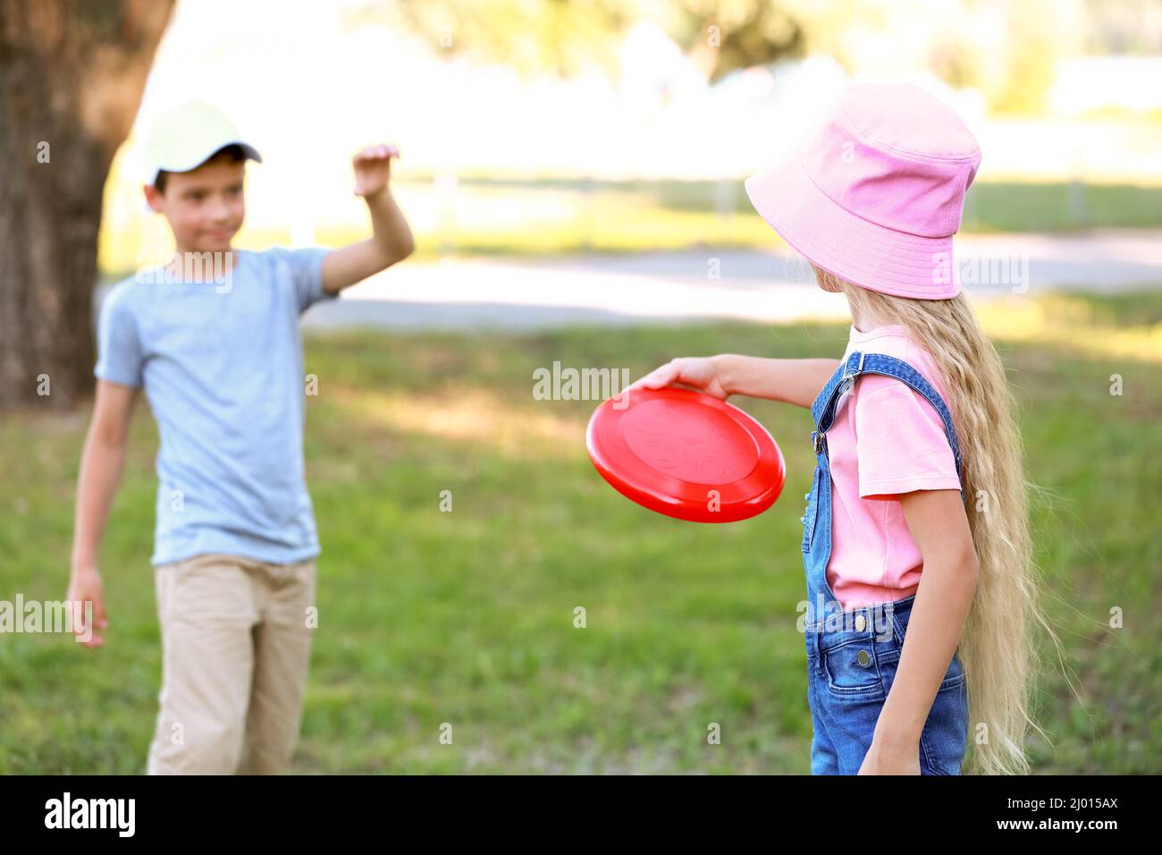 Cute little children playing frisbee outdoors Stock Photo - Alamy
