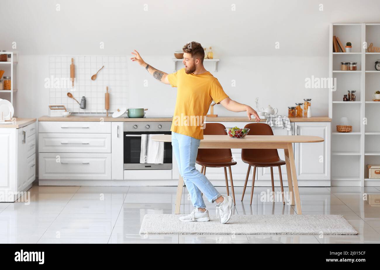 Cool young man dancing at home Stock Photo - Alamy