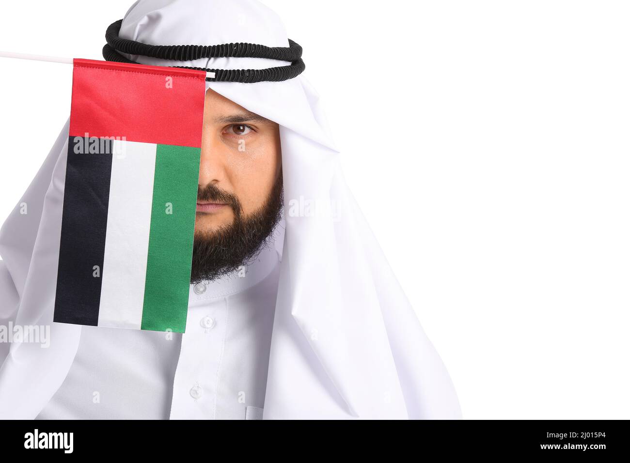 Man in traditional clothes and with the national flag of UAE on white ...