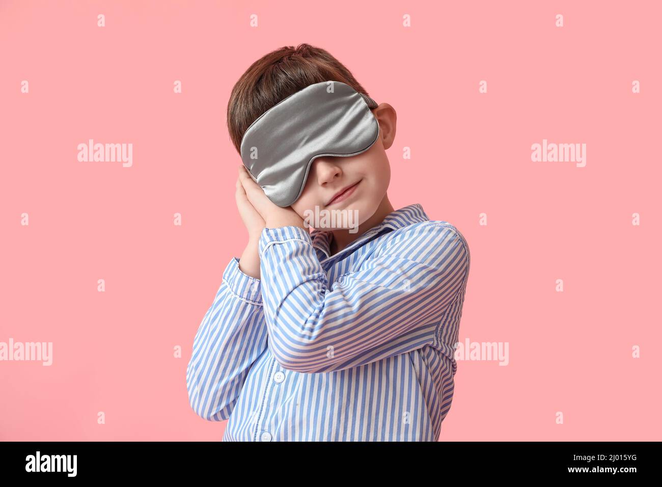 Little boy with sleep mask on color background Stock Photo - Alamy
