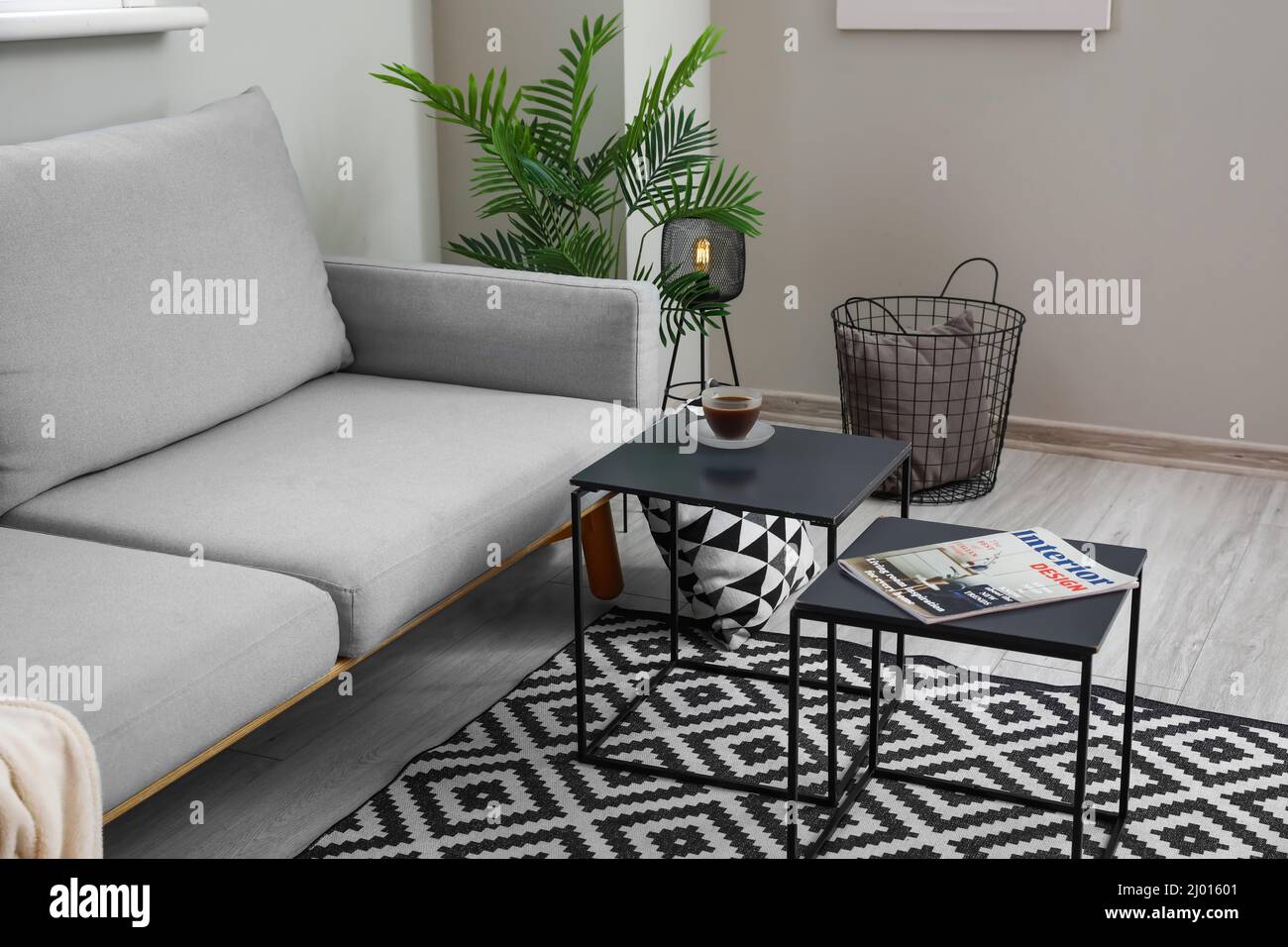 Modern interior of room with coffee table and sofa Stock Photo - Alamy