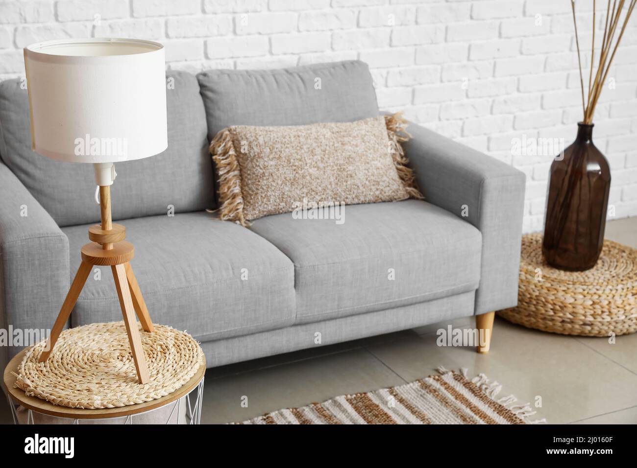 Stylish lamp on coffee table in living room Stock Photo - Alamy