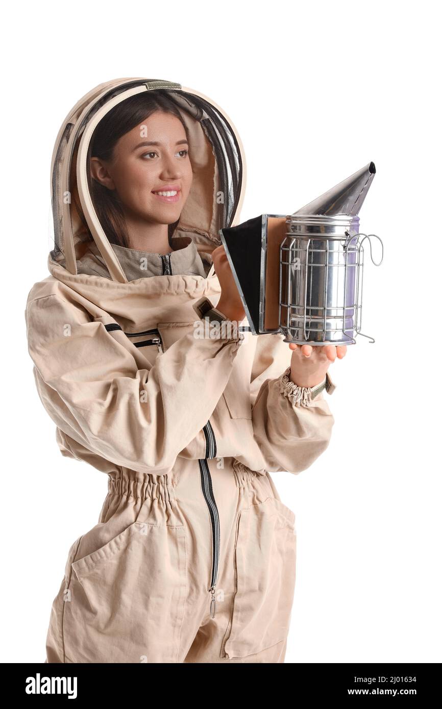 Female beekeeper in protective suit with smoker on white background ...