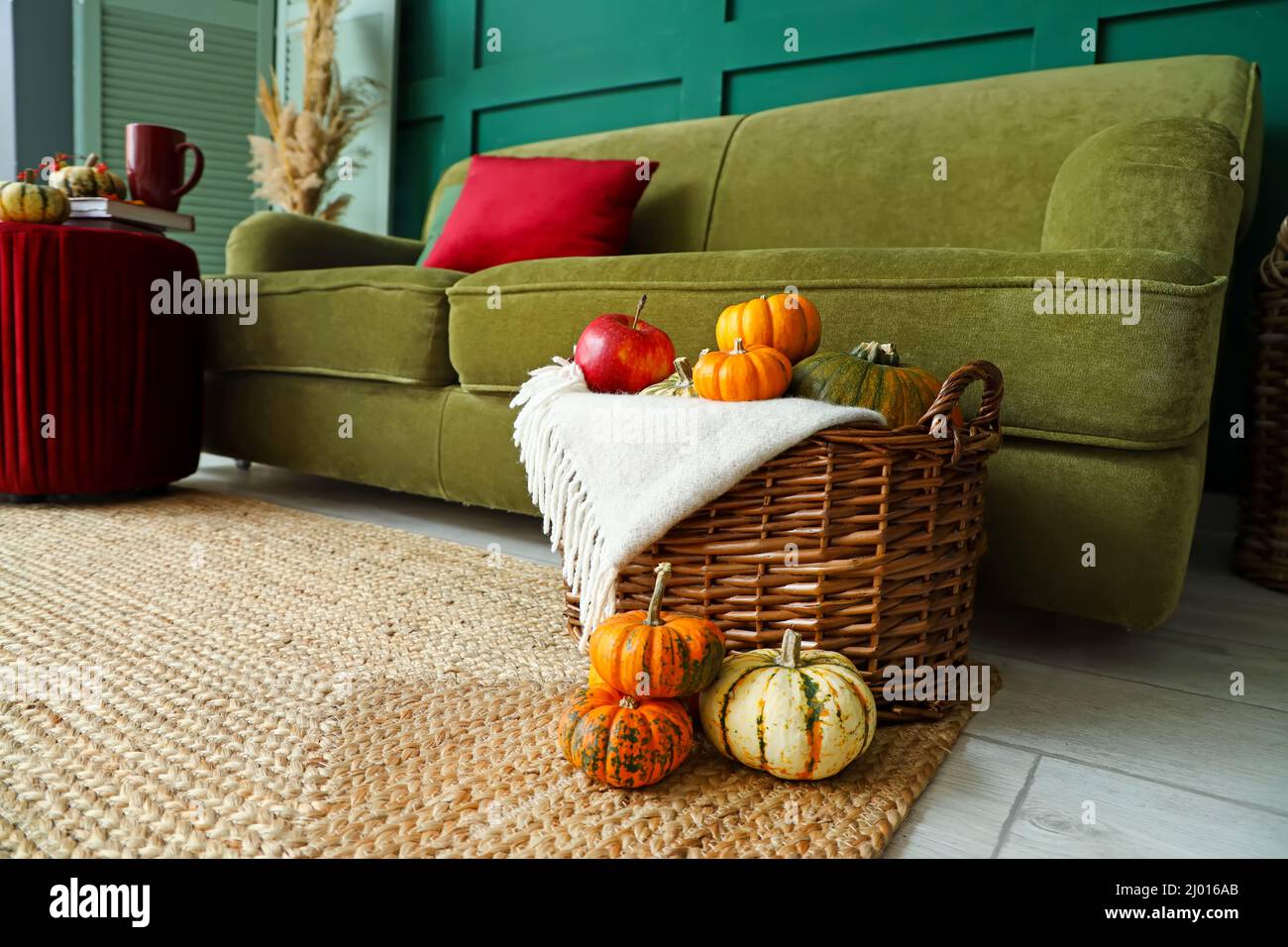 Interior of beautiful living room with autumn decor Stock Photo - Alamy