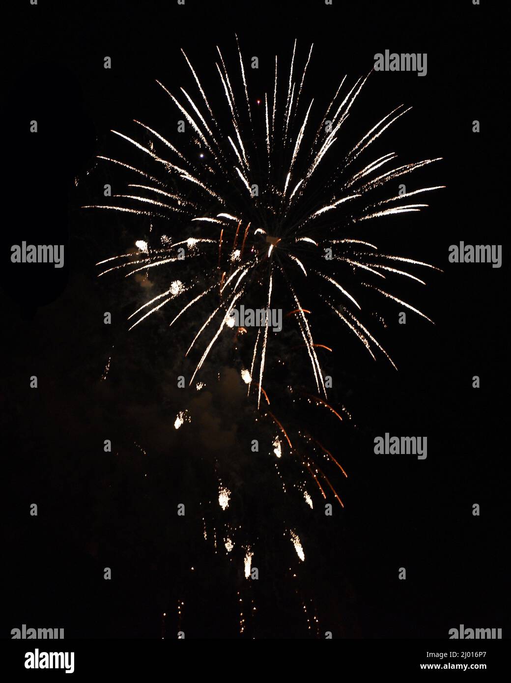 Vertical shot of fireworks in the night sky Stock Photo - Alamy