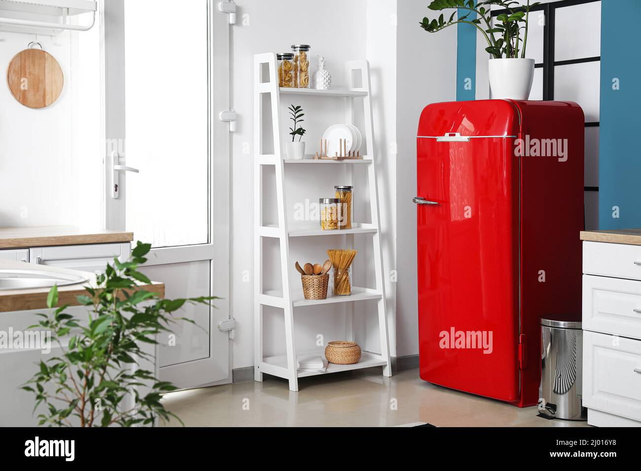 Red vintage fridge in interior of kitchen Stock Photo - Alamy