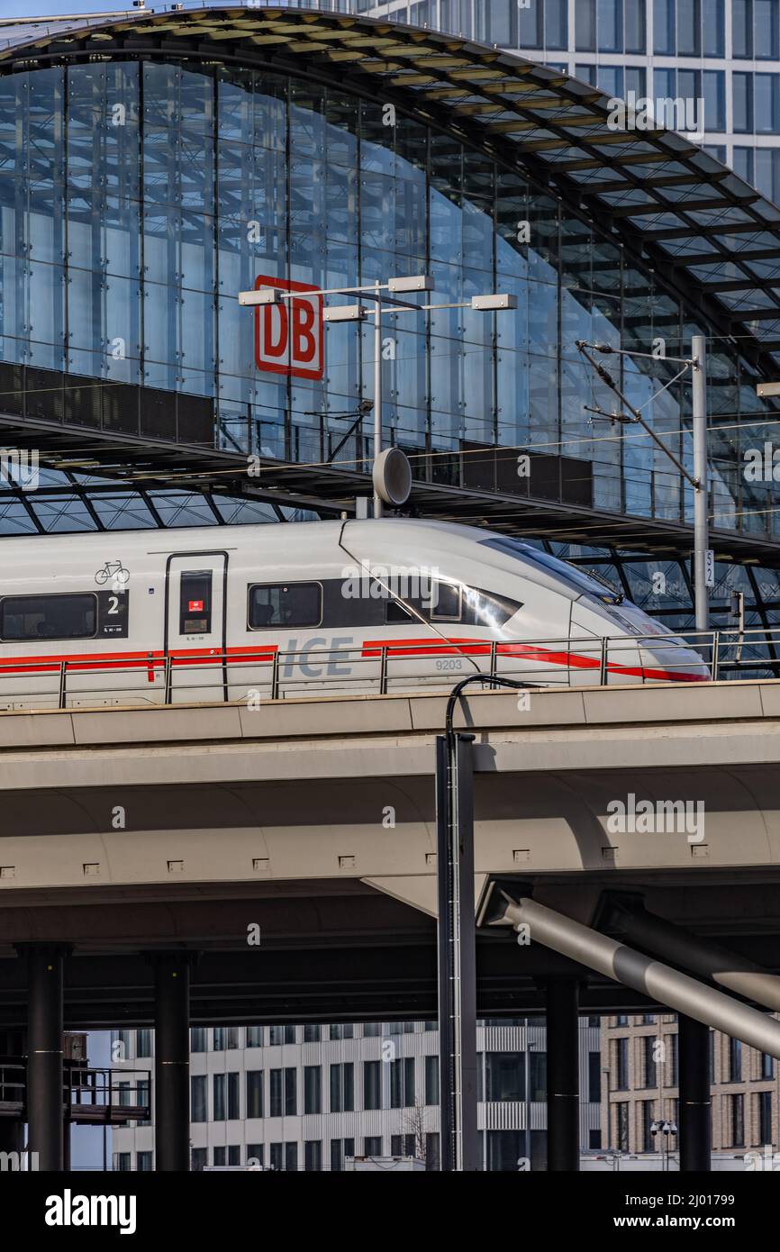 Modern train with a beautiful building in background in Berlin, Germany ...