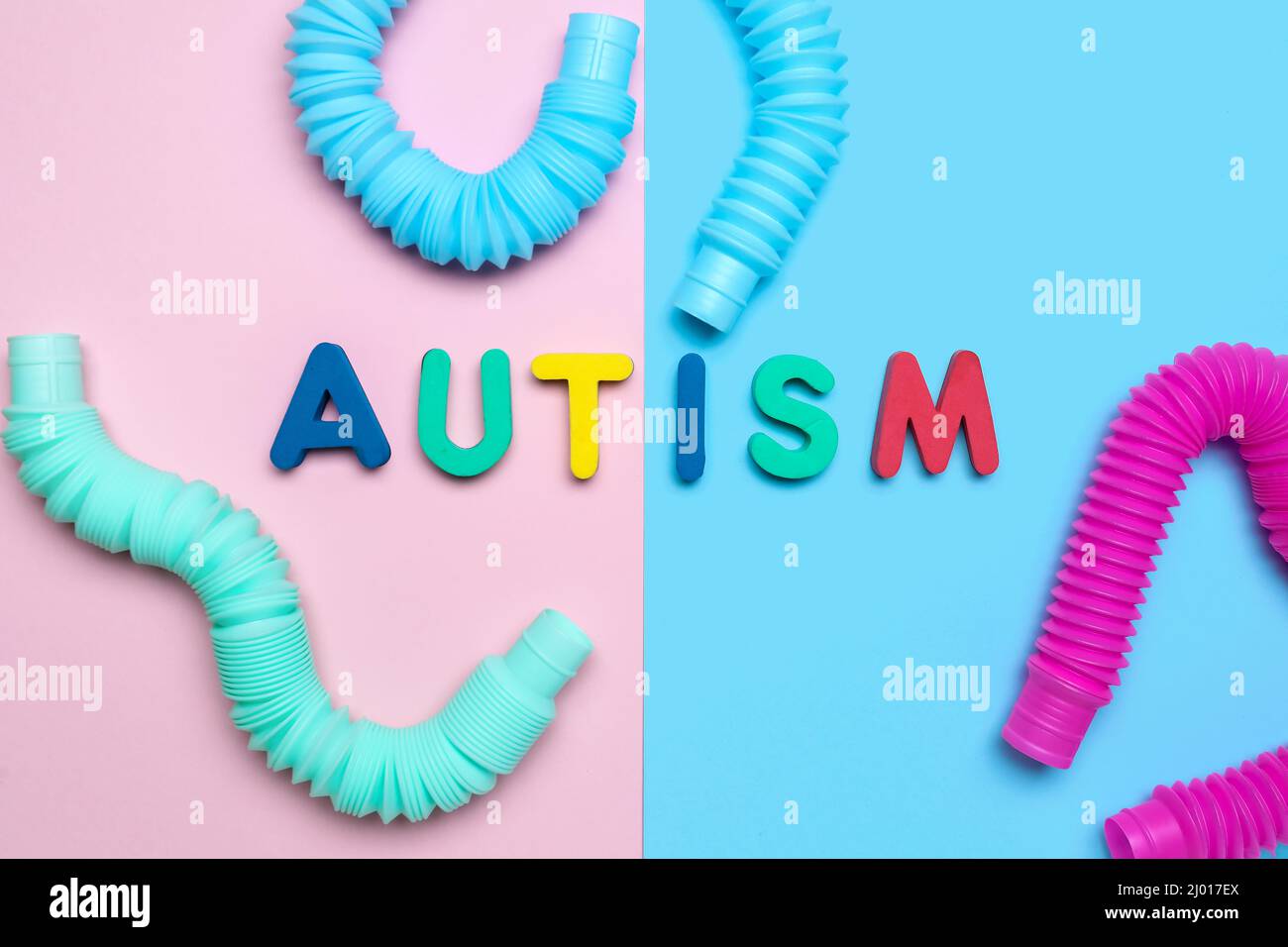 Word AUTISM with Pop Tubes on color background Stock Photo - Alamy