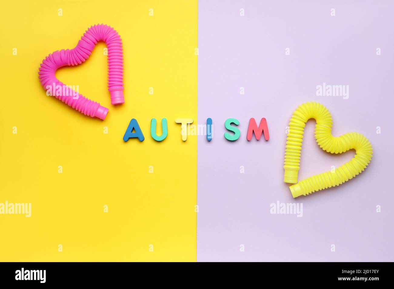 Word AUTISM with Pop Tubes on color background Stock Photo - Alamy