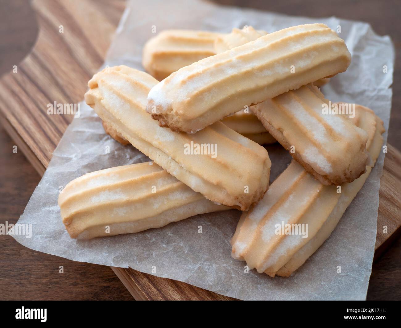 Viennese shortbreads on a wooden board. Italian buttery shortbread ...