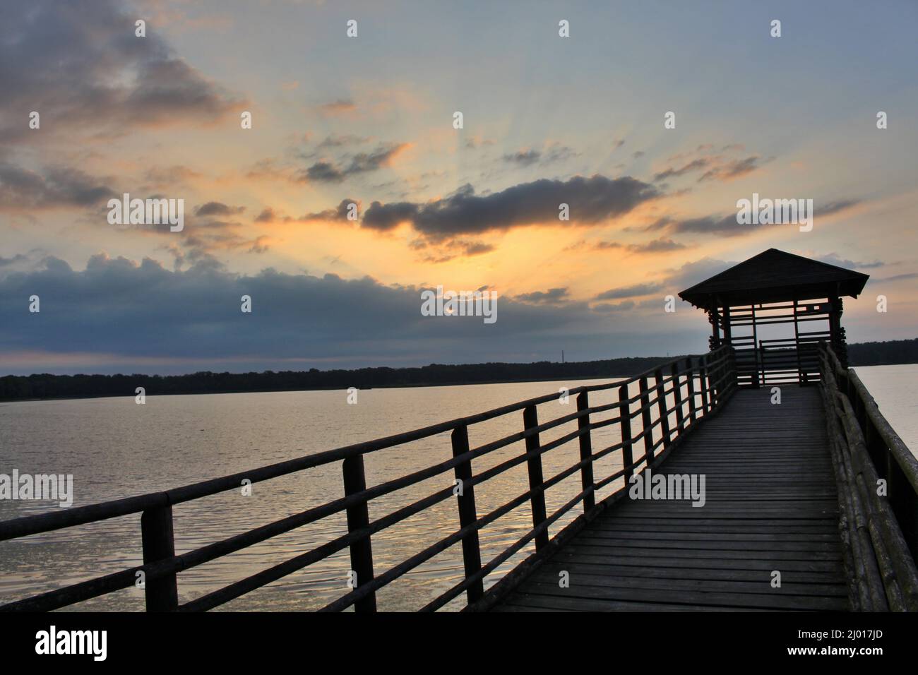 Beautiful view of a wooden pier during the sunset Stock Photo - Alamy