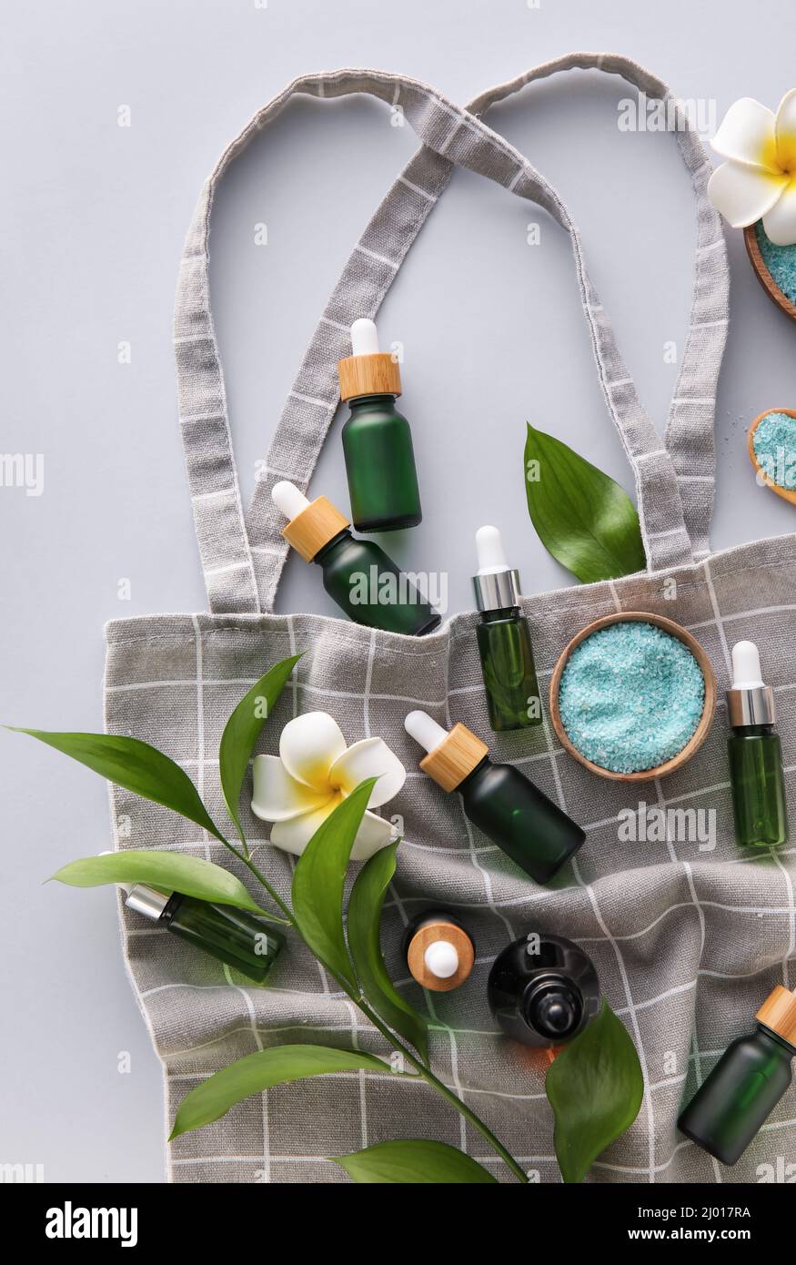 Shopping bag with natural cosmetics on light background Stock Photo - Alamy