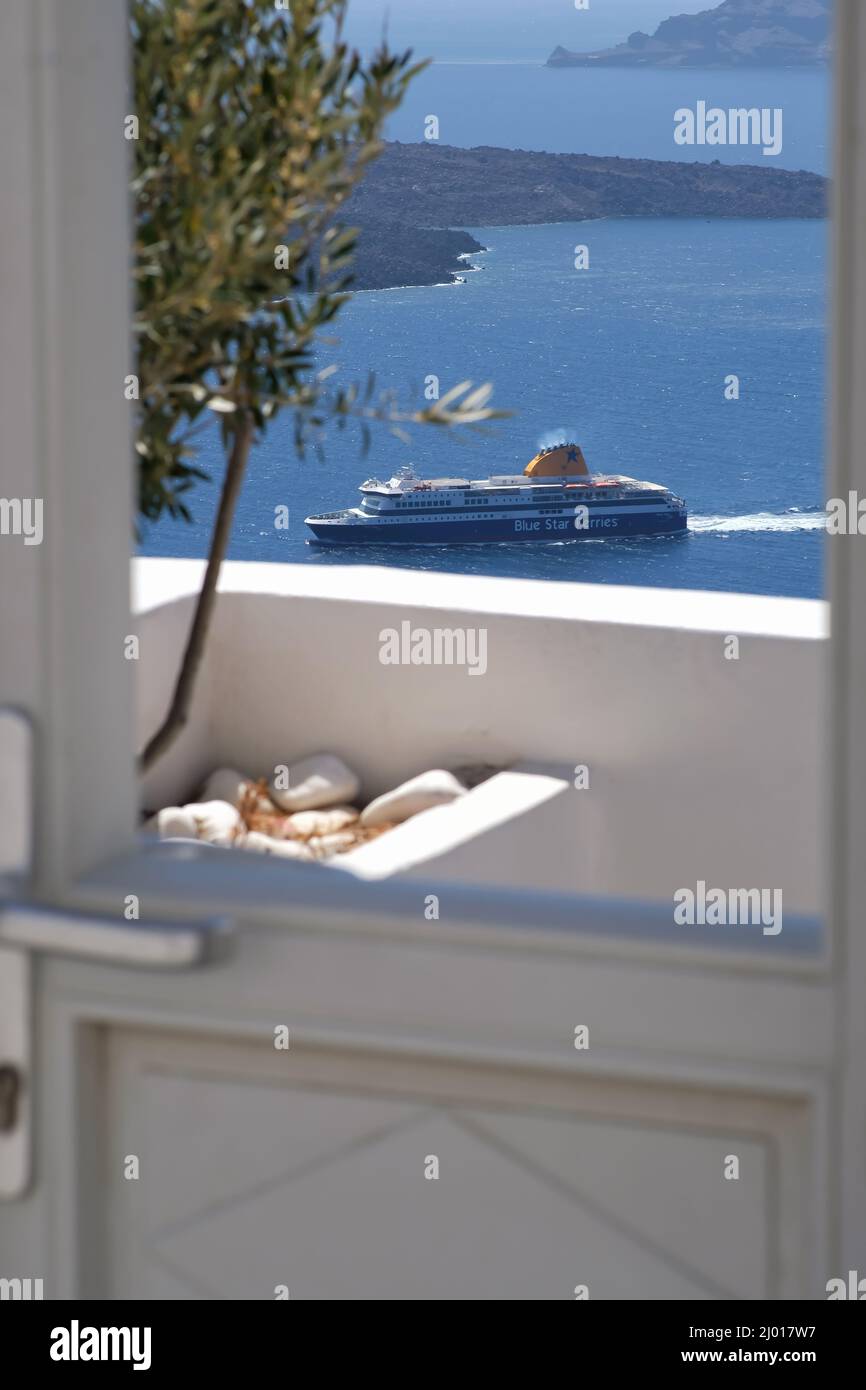 Santorini, Greece - May 10, 2021 : View through a window frame and a ...