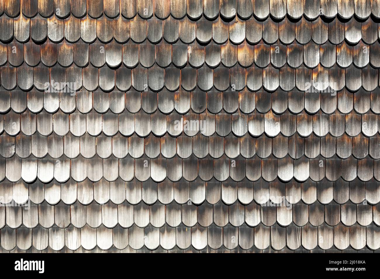 The roof is made of wooden shingles. Background and texture, close-up ...