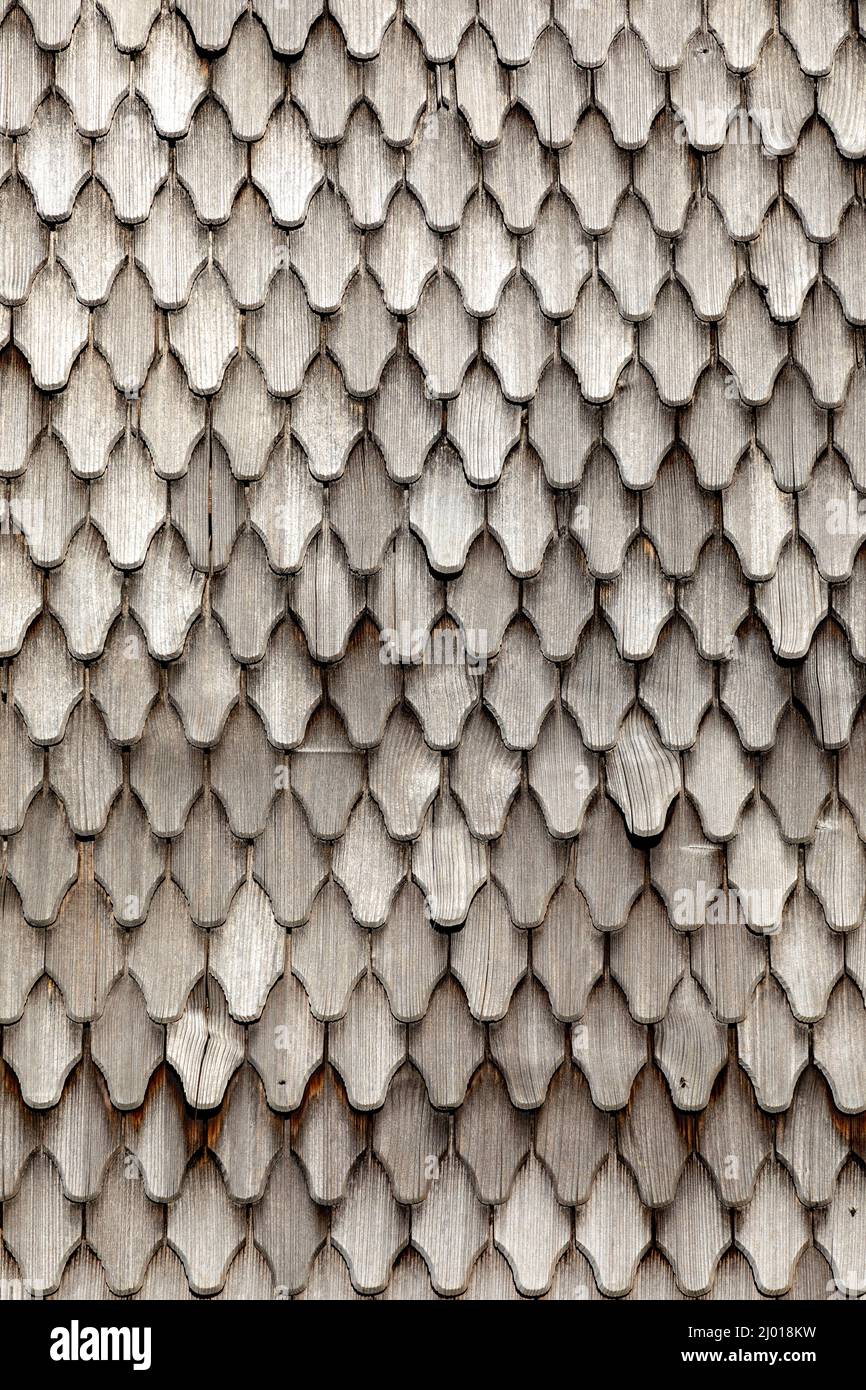 The roof is made of wooden shingles. Background and texture, close-up ...