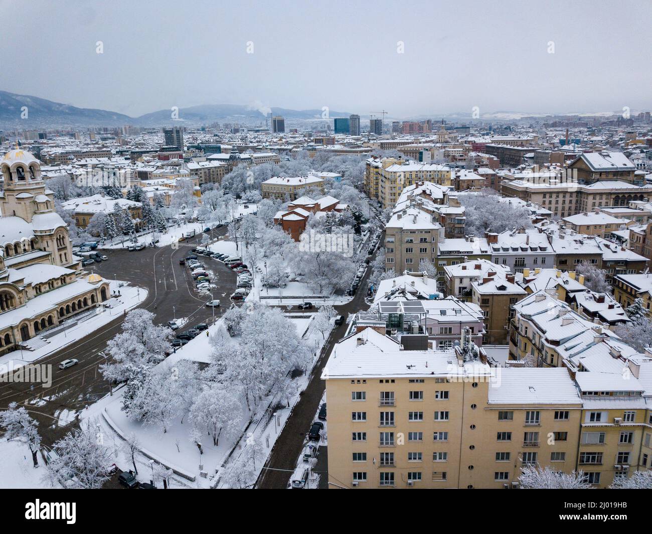 Aerial view of the snowy city in the cold winter in Sofia, Bulgaria ...