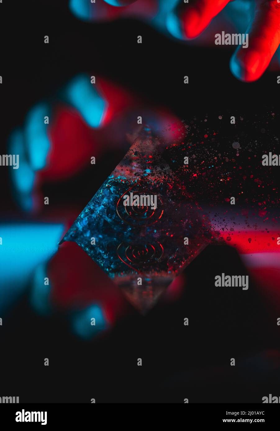 Dissolving metal object with a pyramid illusion Stock Photo - Alamy