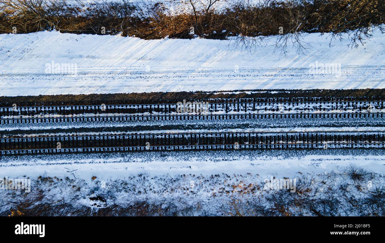 Aerial view of rails covered with snow Stock Photo - Alamy