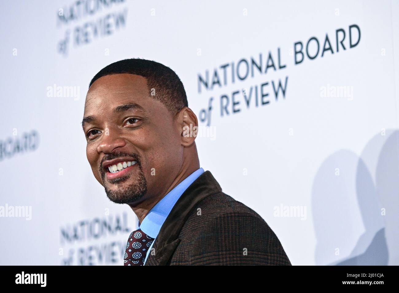 Will Smith walking on the red carpet during the National Board of ...