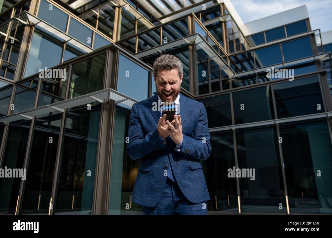 communication. shouting businessman hold smartphone. man boss has ...