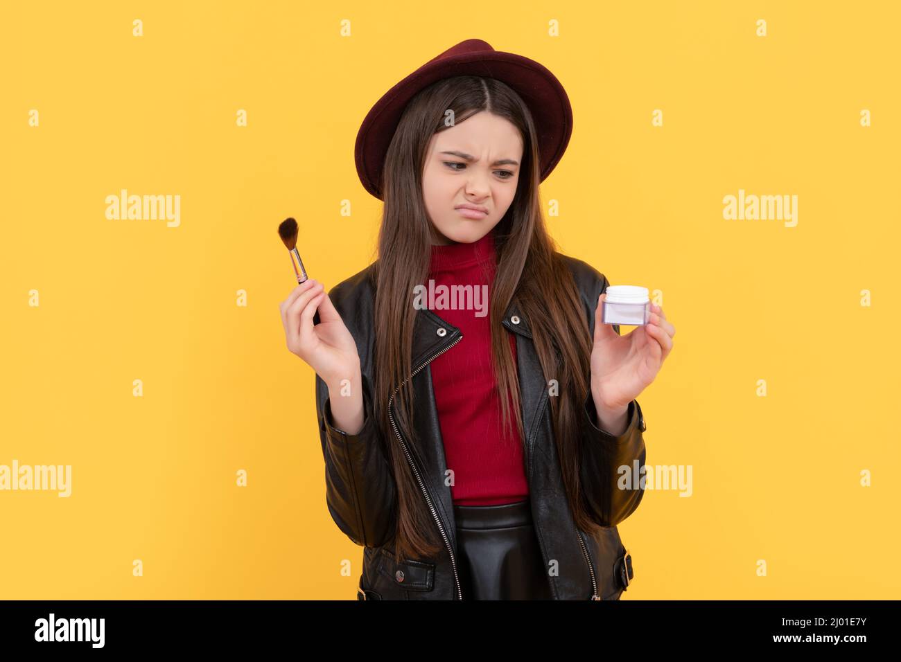 sad child apply face powder. teen girl hold blush. kid with makeup ...