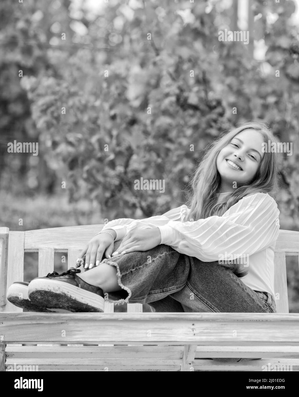 glad child sit on bench outdoor, relaxation Stock Photo - Alamy