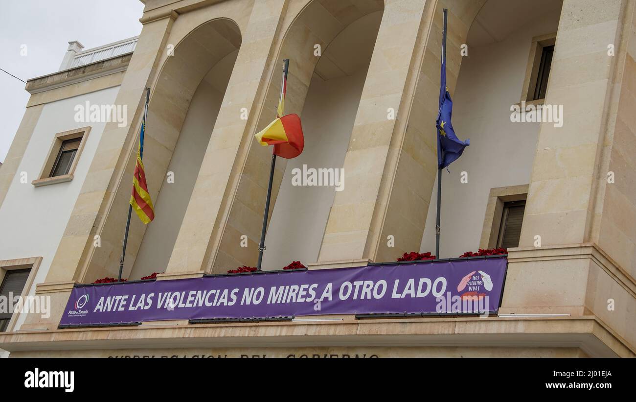 "IN THE FACE OF VIOLENCE, DO NOT LOOK THE OTHER WAY" banner on Alicante ...