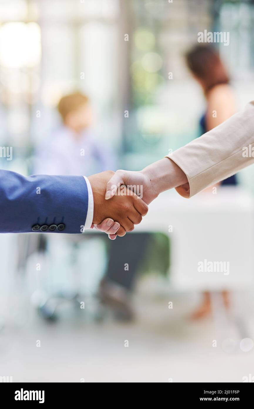 Sealing the deal. Shot of two businesspeople shaking hands Stock Photo ...