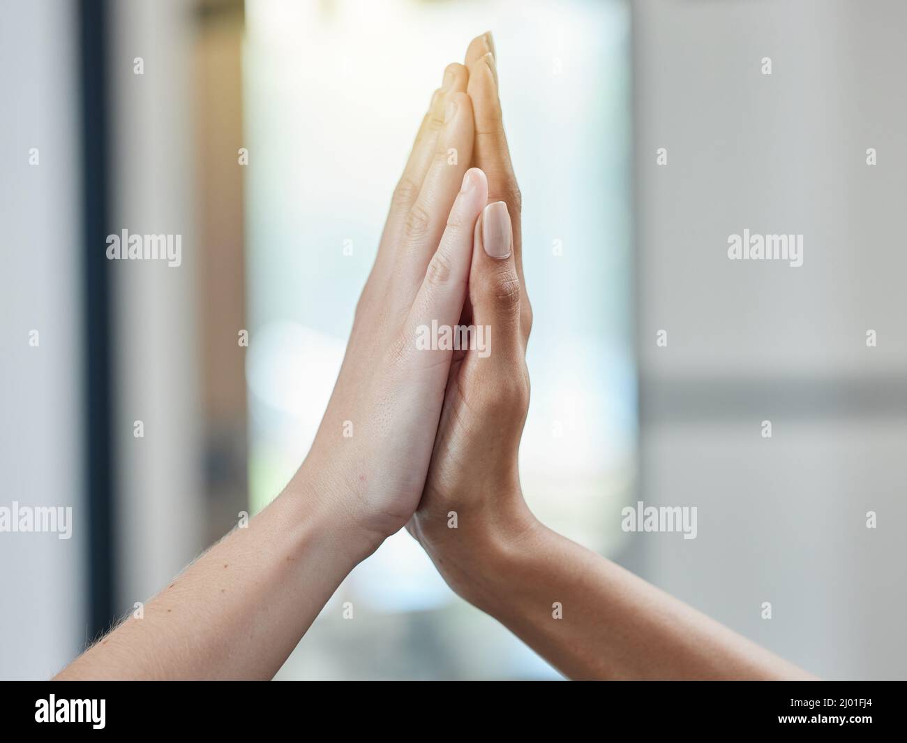 Teamwork is the answer to success. Closeup shot of two unrecognisable ...